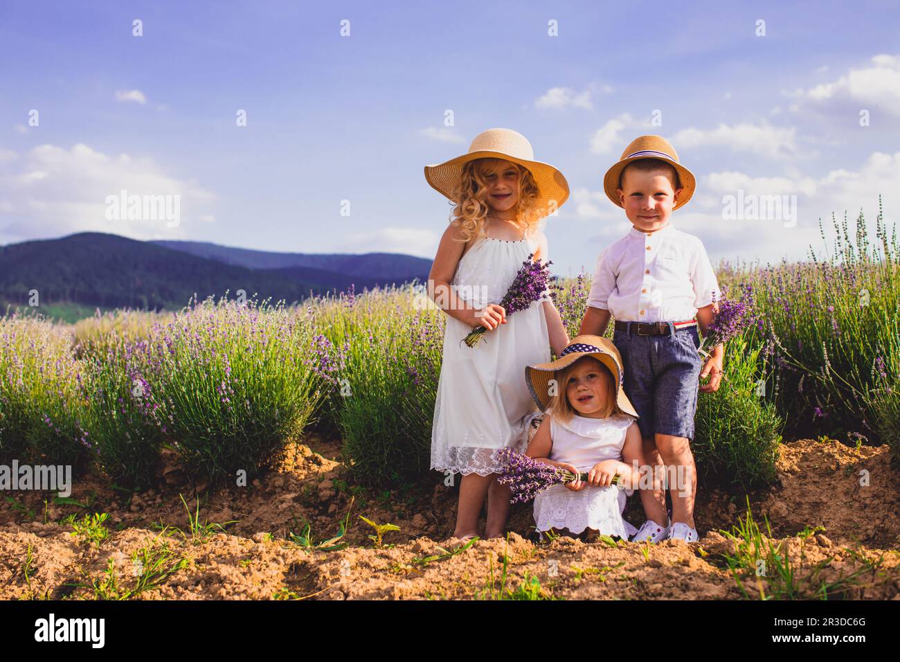 Three adorable kids, brother and two sisters Stock Photo - Alamy