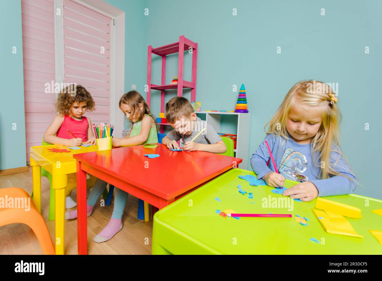 The kids create bright things together in the kindergarten Stock Photo ...
