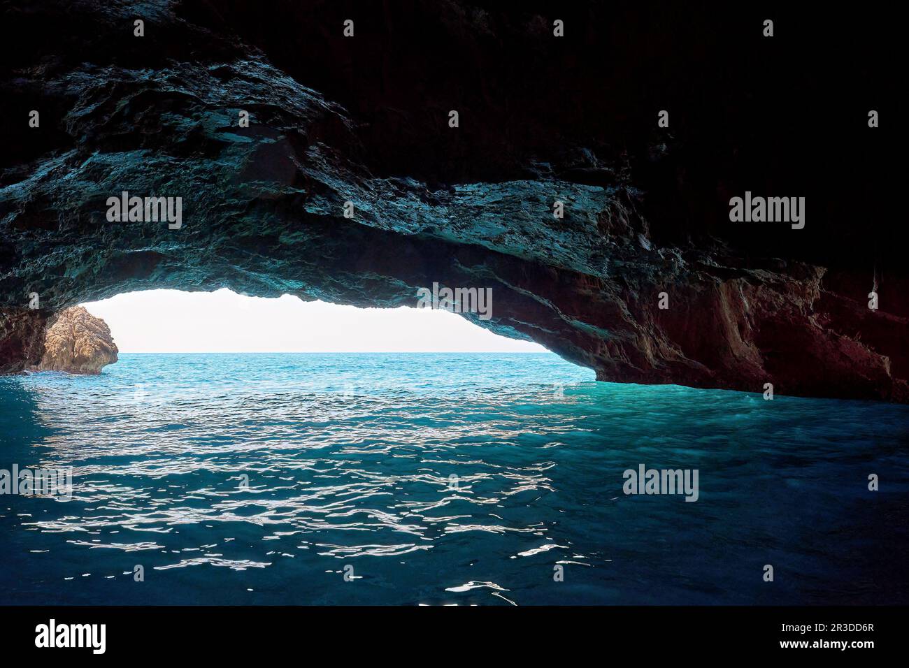 Famous Montenegro Blue Cave in the Adriatic sea. Deep turquoise water ...