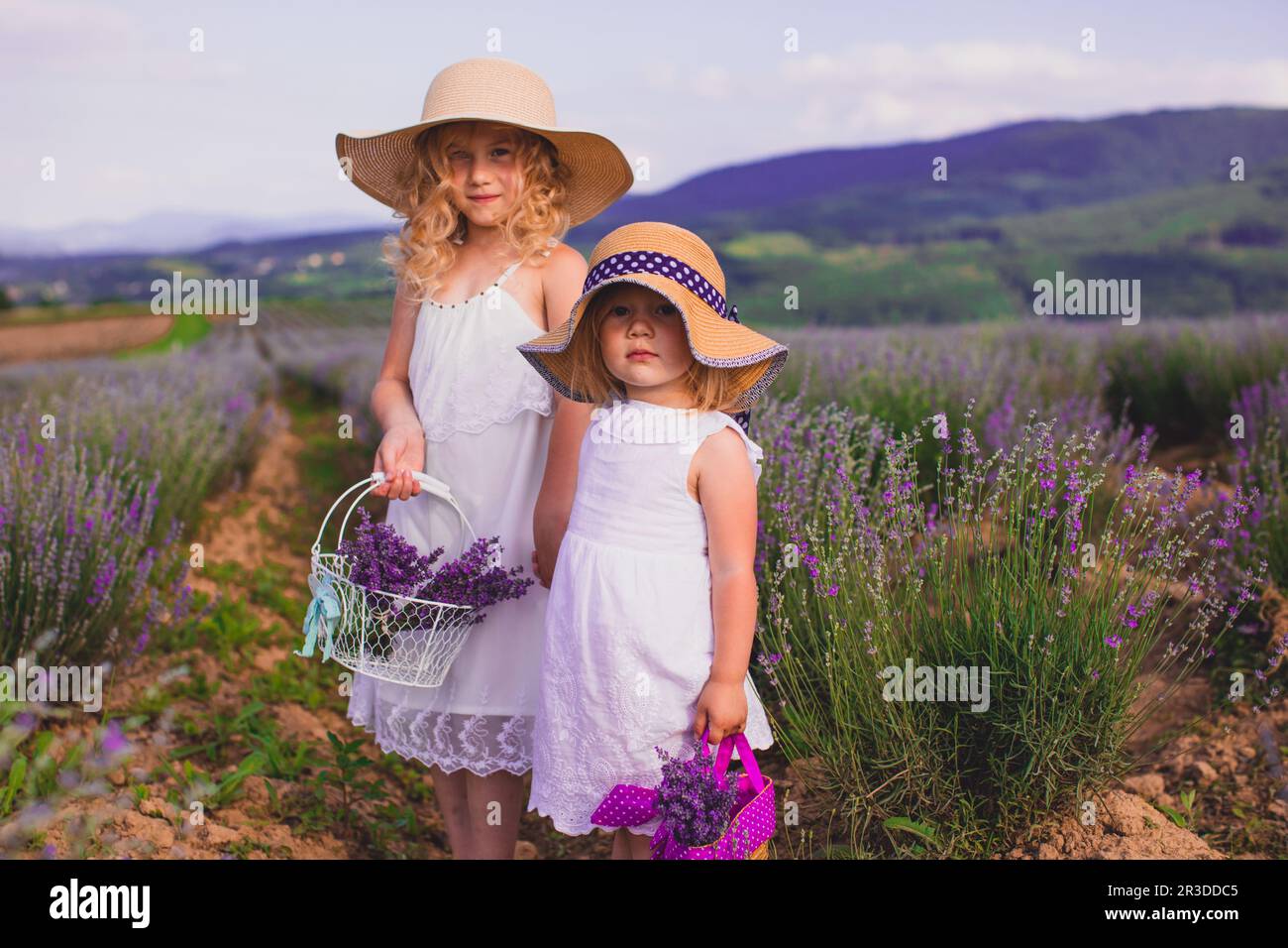 Two cute sisters travel through beautiful nature Stock Photo - Alamy