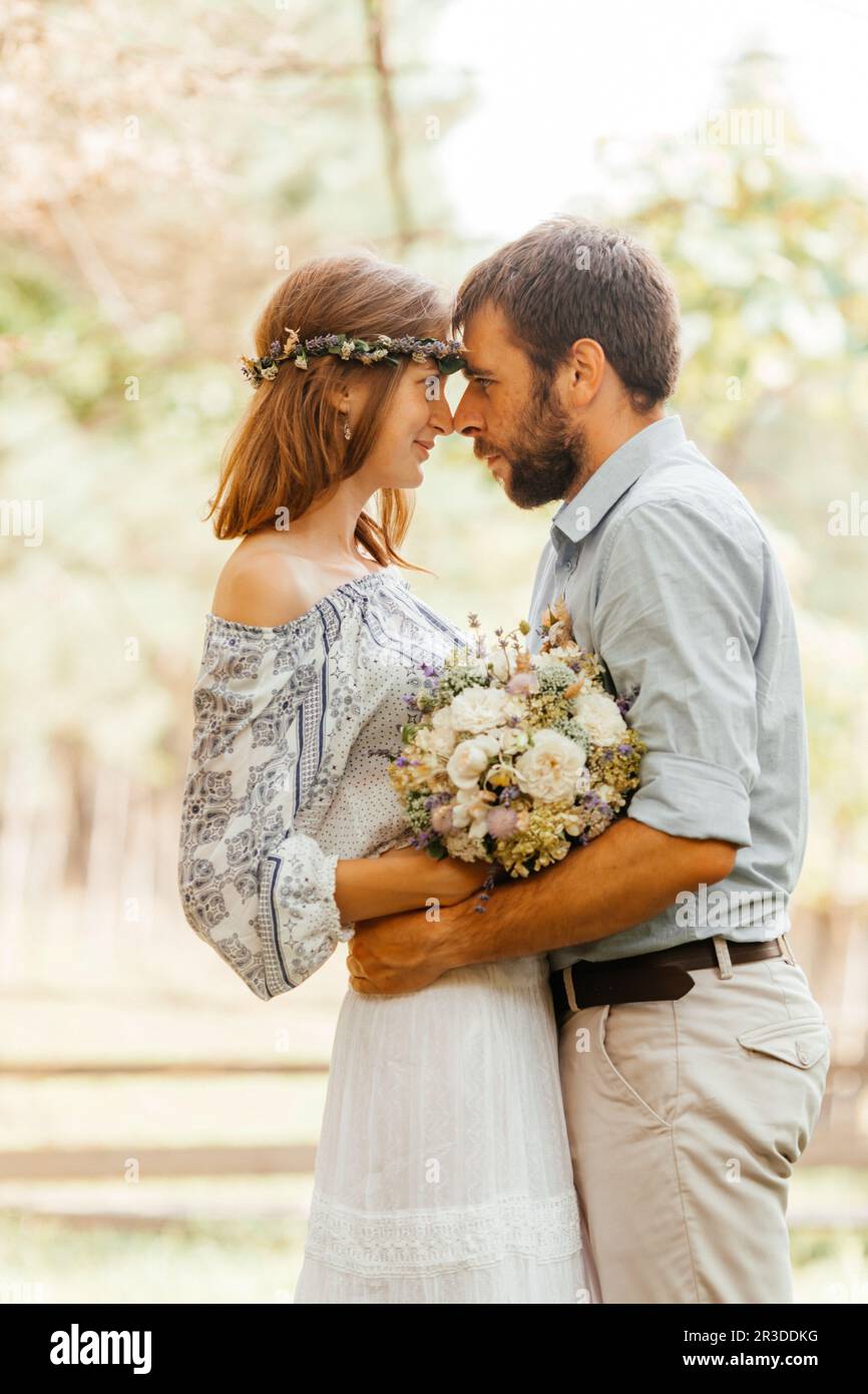 Eclectic rustic wedding couple. Intimate ceremony at backyard Stock ...