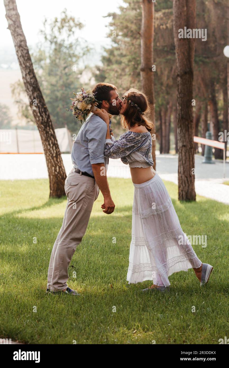 Eclectic rustic wedding couple. Intimate ceremony at backyard Stock ...