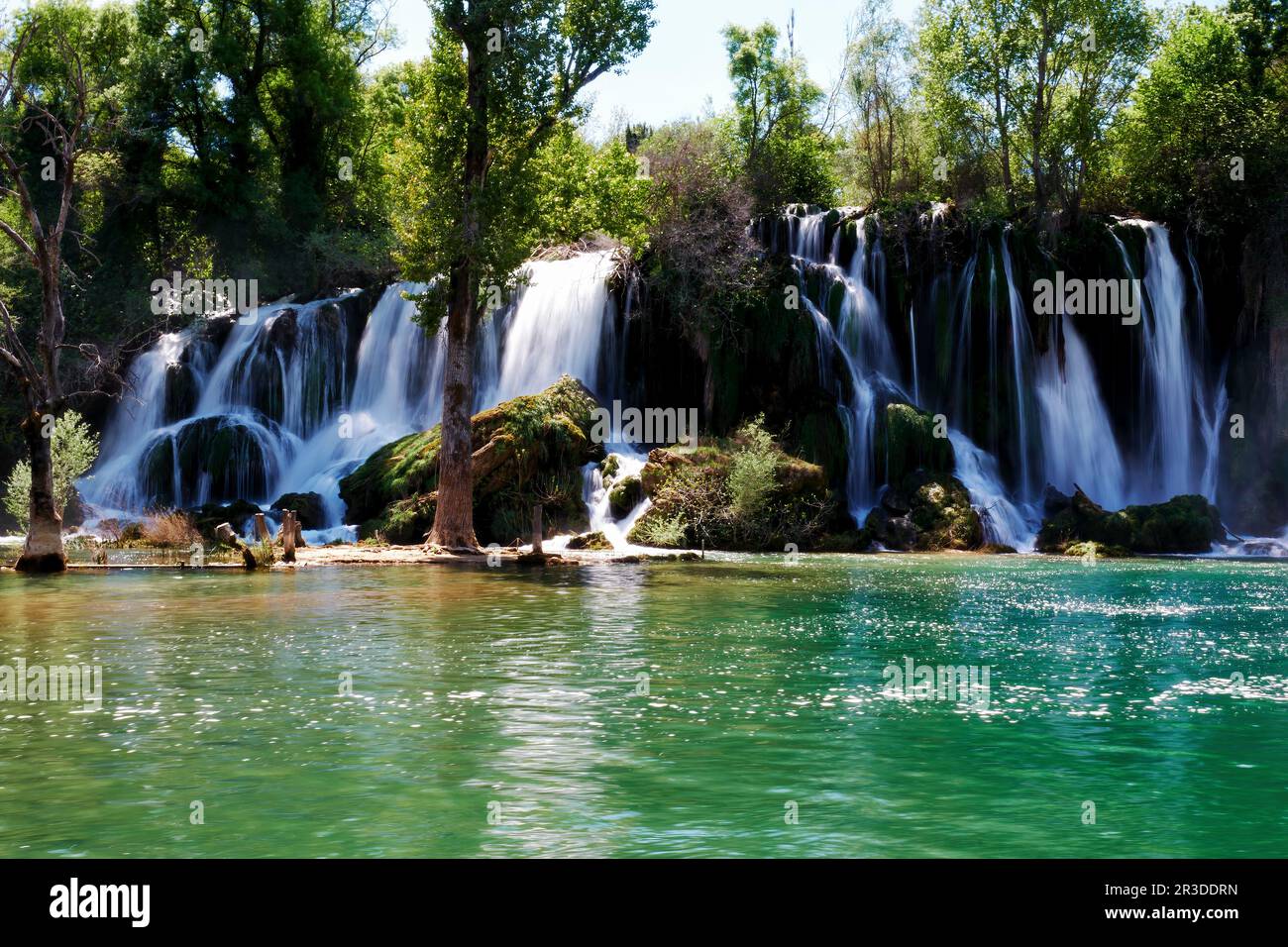 Famous Kravica waterfall in Bosnia and Herzegovina. Spring time. Blurred water flow. Wide ...