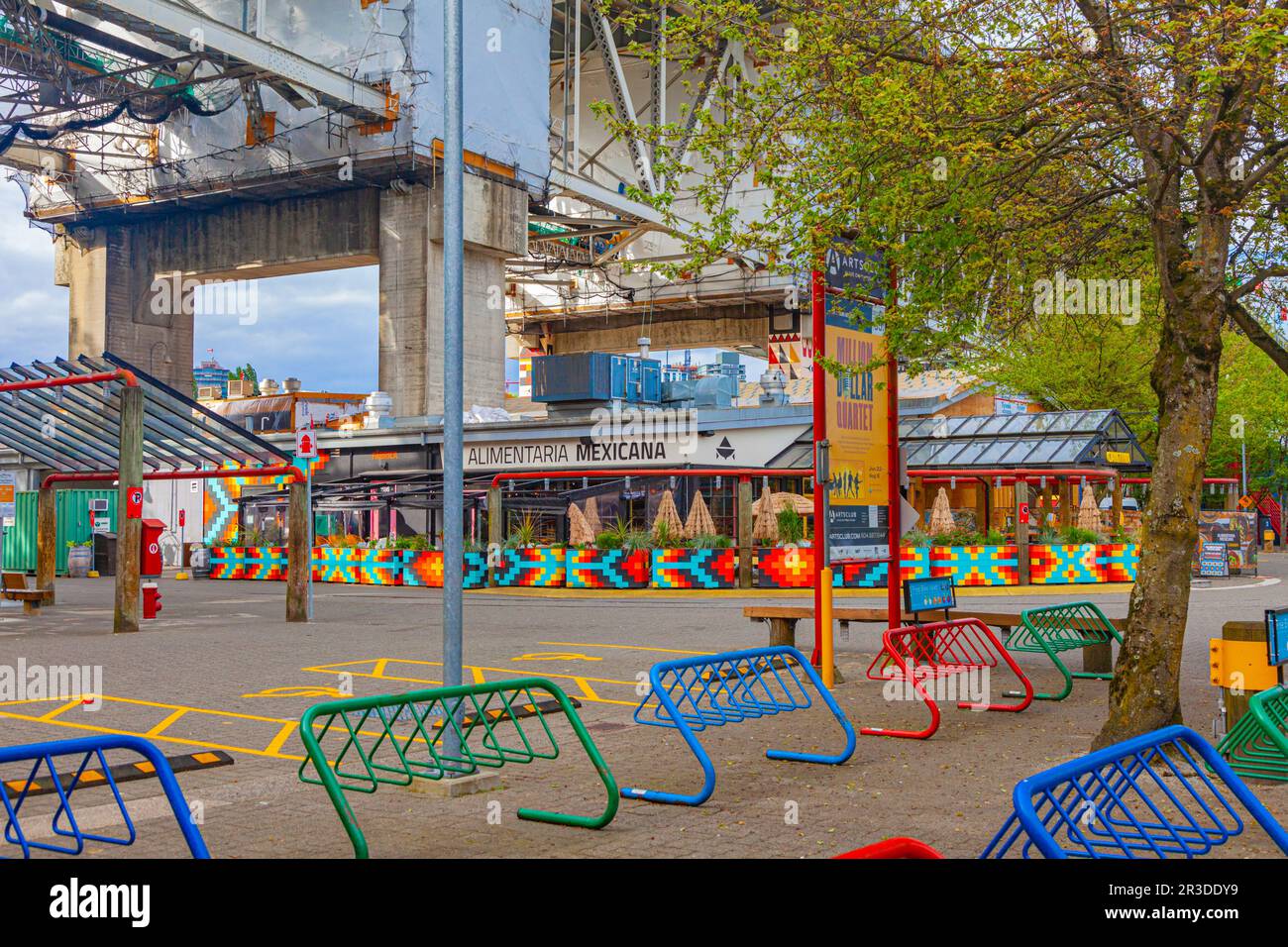 Colourful plaza under the Granville Bridge on Granville Island in ...