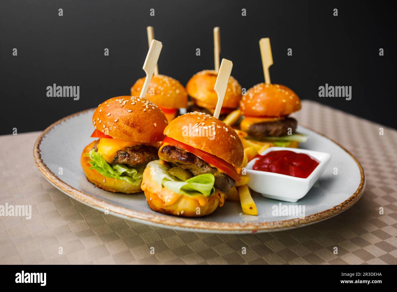 Mini burgers and fried potatoes on the plate Stock Photo - Alamy