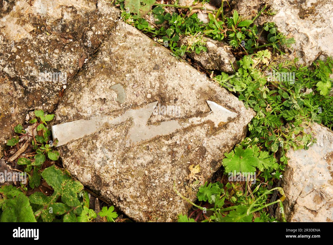 Danger lightning sign on the old stone brick on the road. Electricity ...