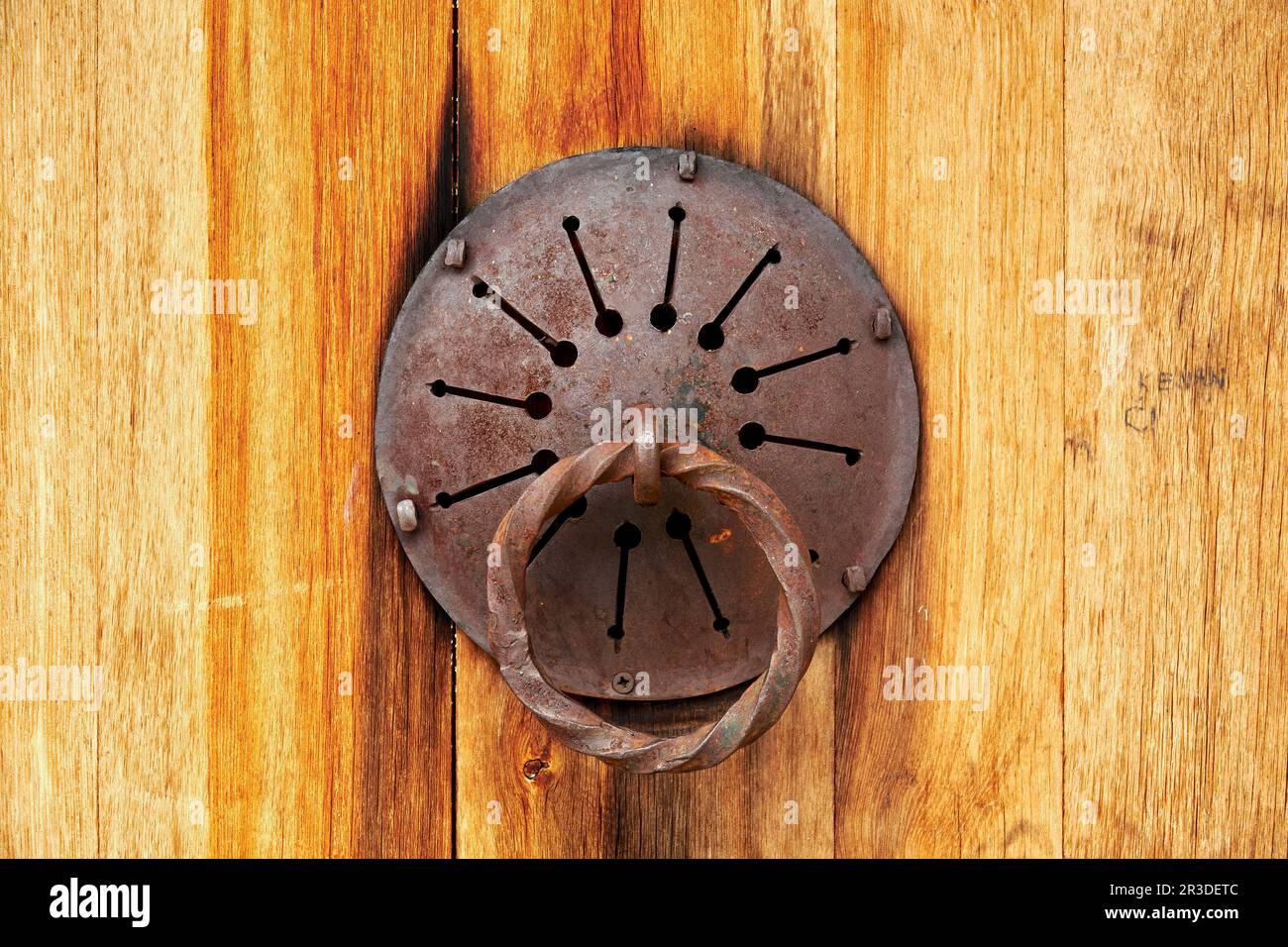 Vintage rusty door handle knob on the brown wooden door. Old ...