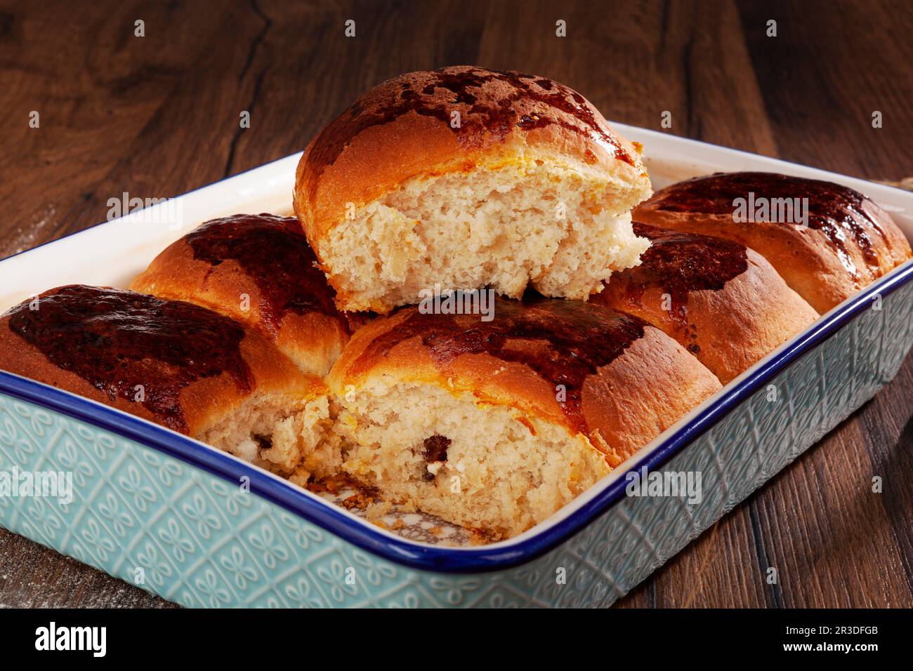 Fresh baked buns with chocolate filling in a ceramic oven tray Stock ...