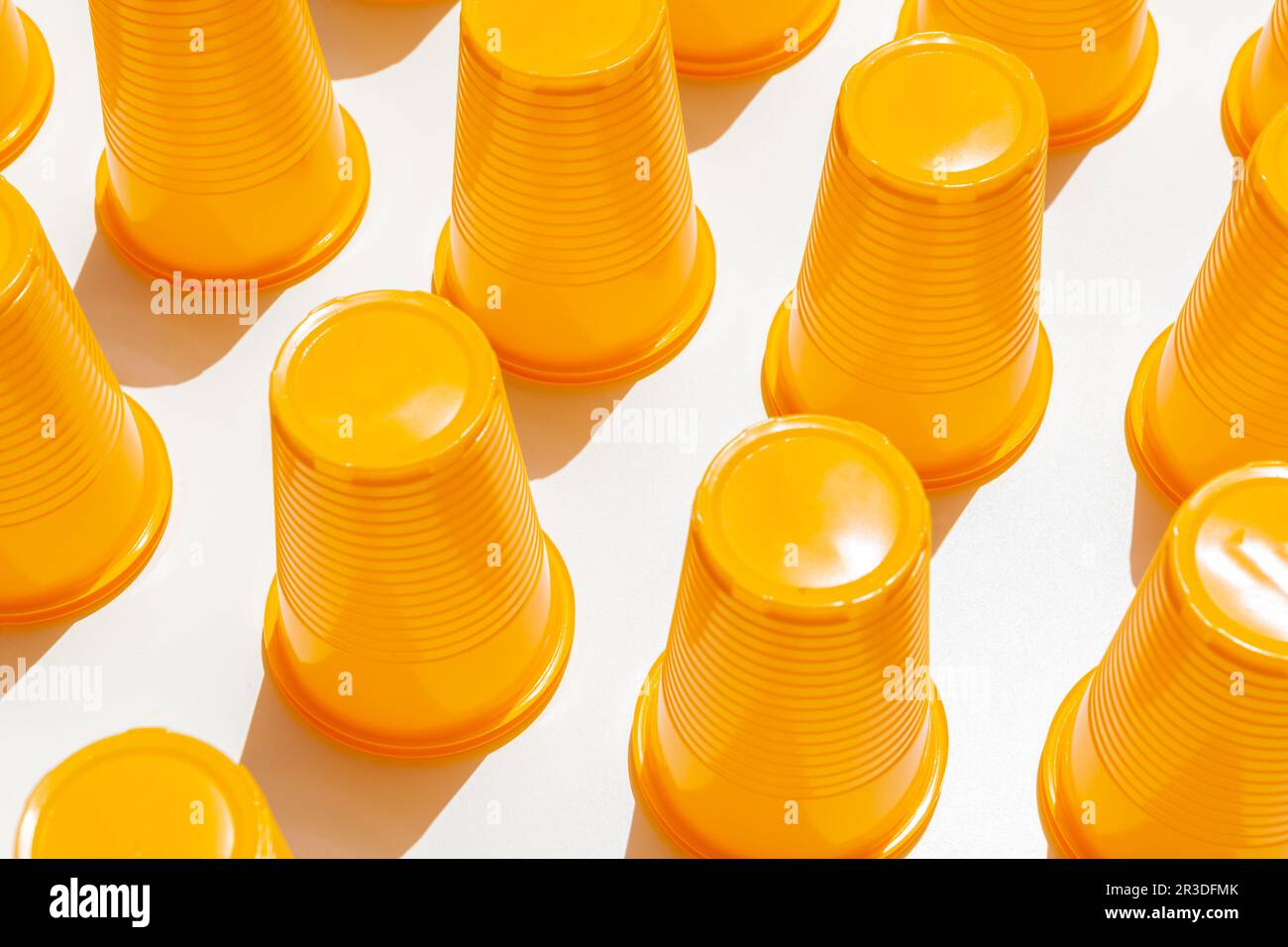 Yellow Plastic Drinking Cups in rows background Stock Photo - Alamy
