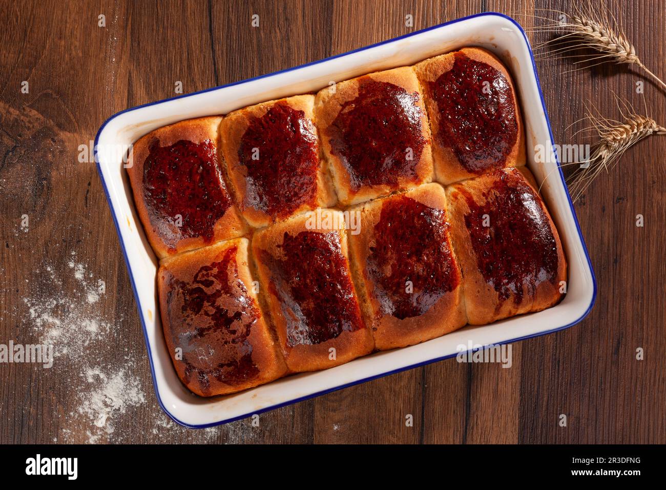Fresh baked buns in a ceramic oven tray from above Stock Photo - Alamy