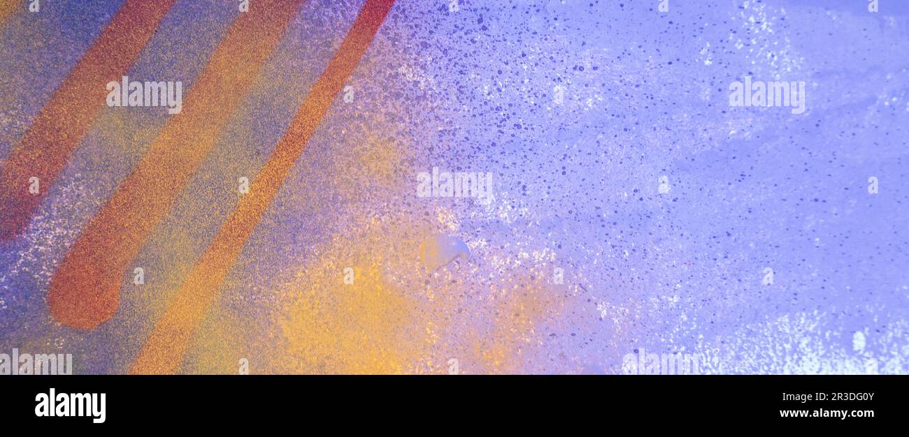 Messy paint strokes and smudges on an old painted wall. Purple, blue ...