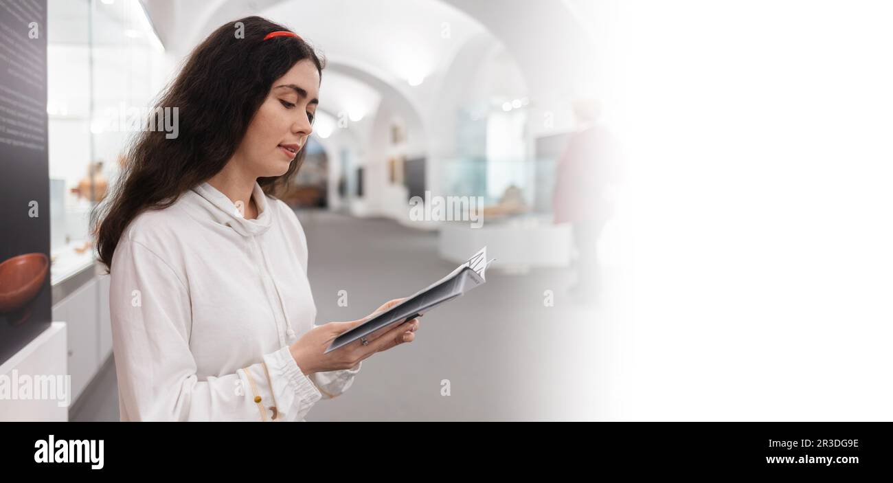 Web banner of educational excursion. Young caucasian woman reading ...
