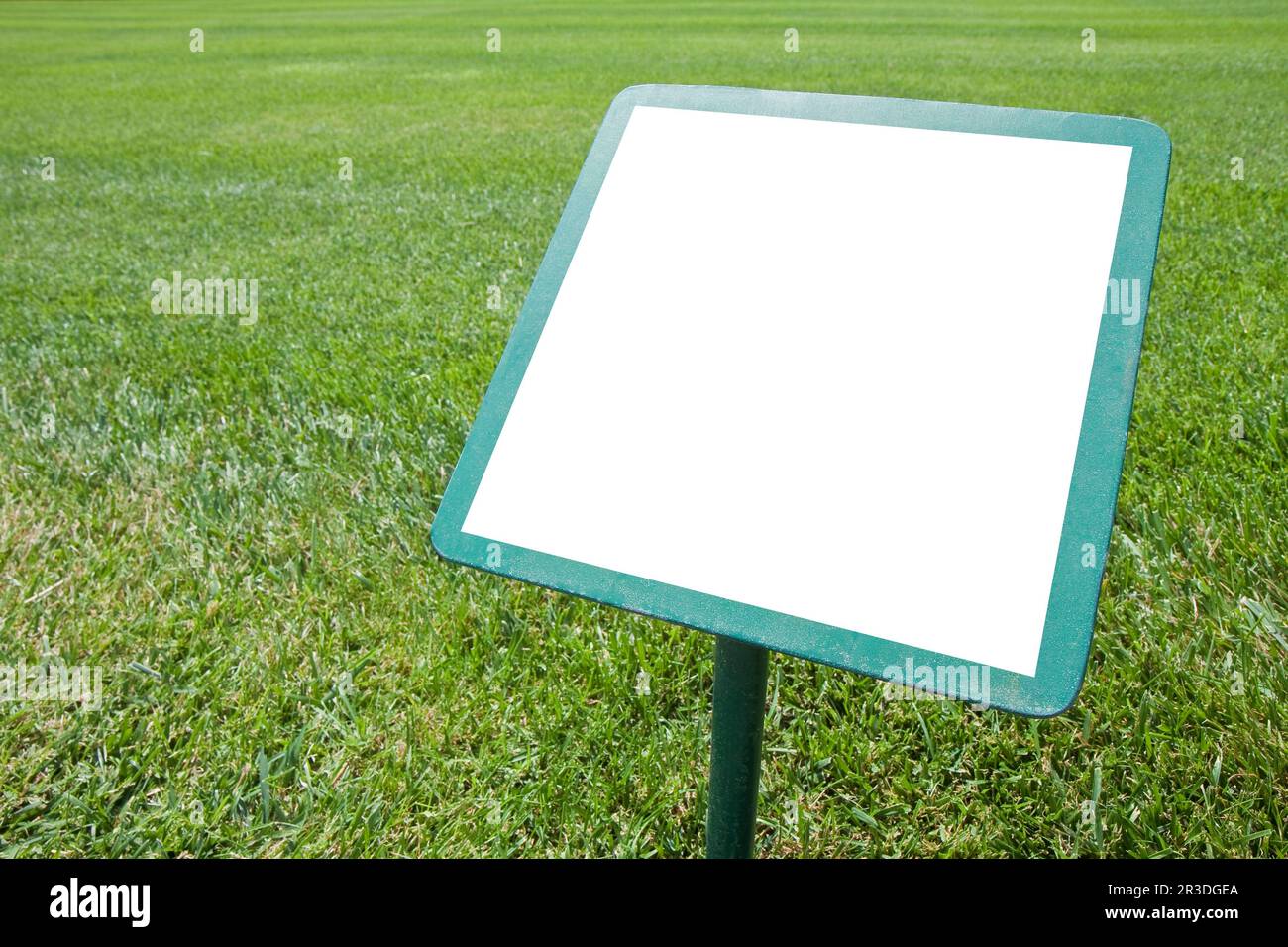 Blank advertising signboard in a green mowed lawn - concept image with ...