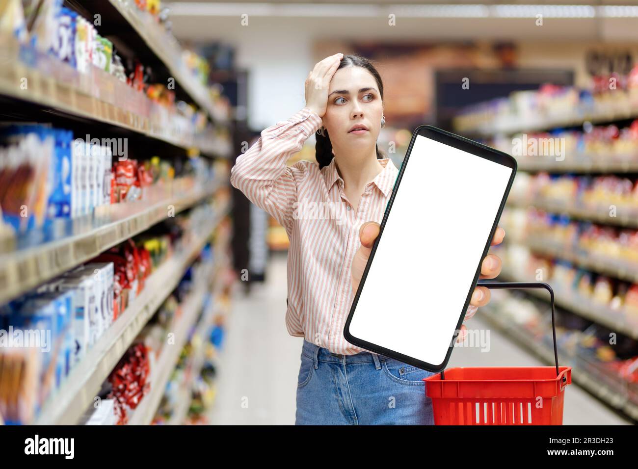 Inflation and high price. Shocked young Caucasian woman holds big ...