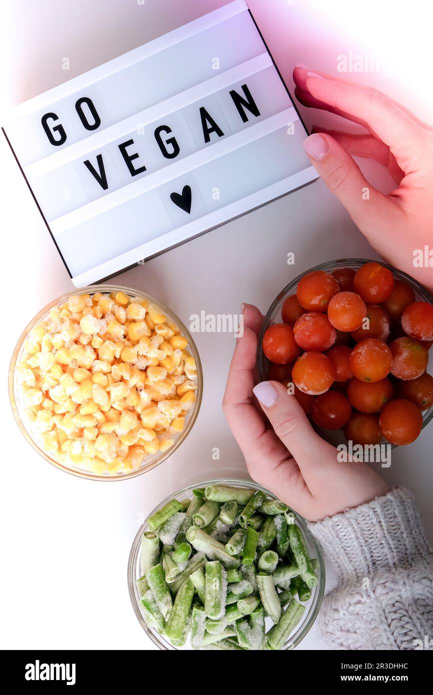 Lightbox with text GO VEGAN Three Bowls of frozen vegetables food of ...