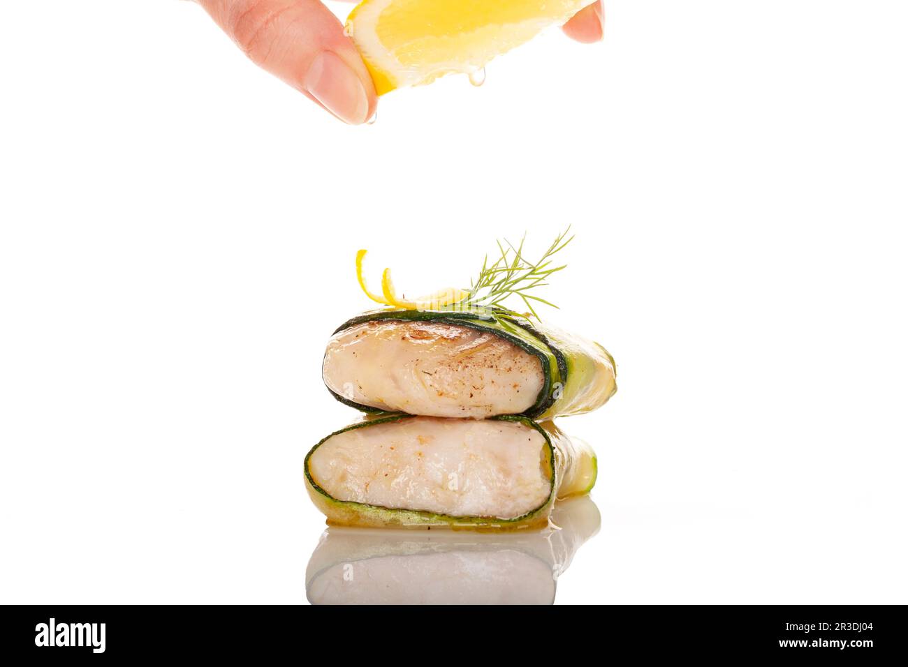 Luxurious seafood dinner. Perch fish fillet in zucchini slices Stock ...