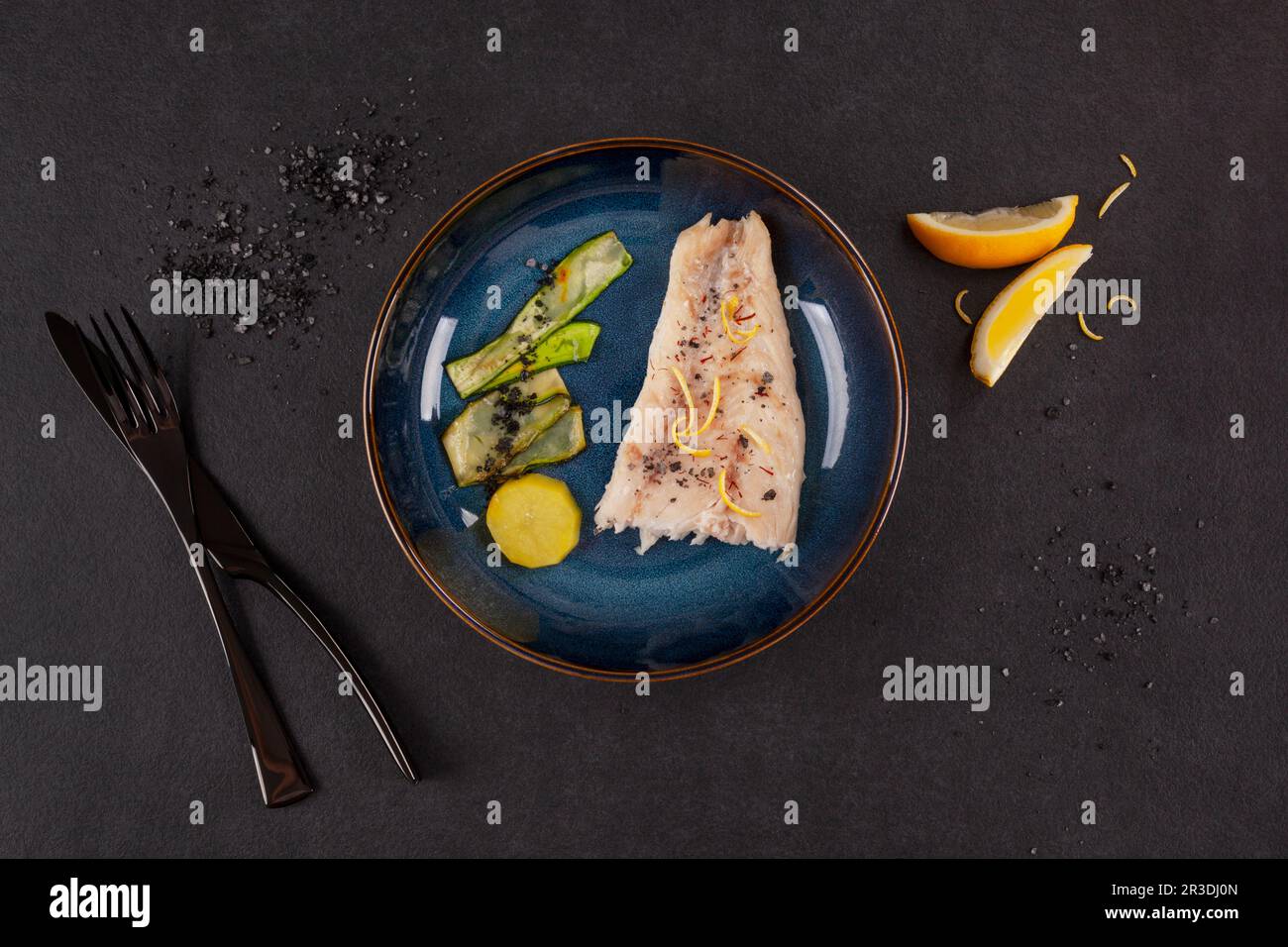 Luxurious seafood dinner. Perch fish fillet with vegetable on black ...