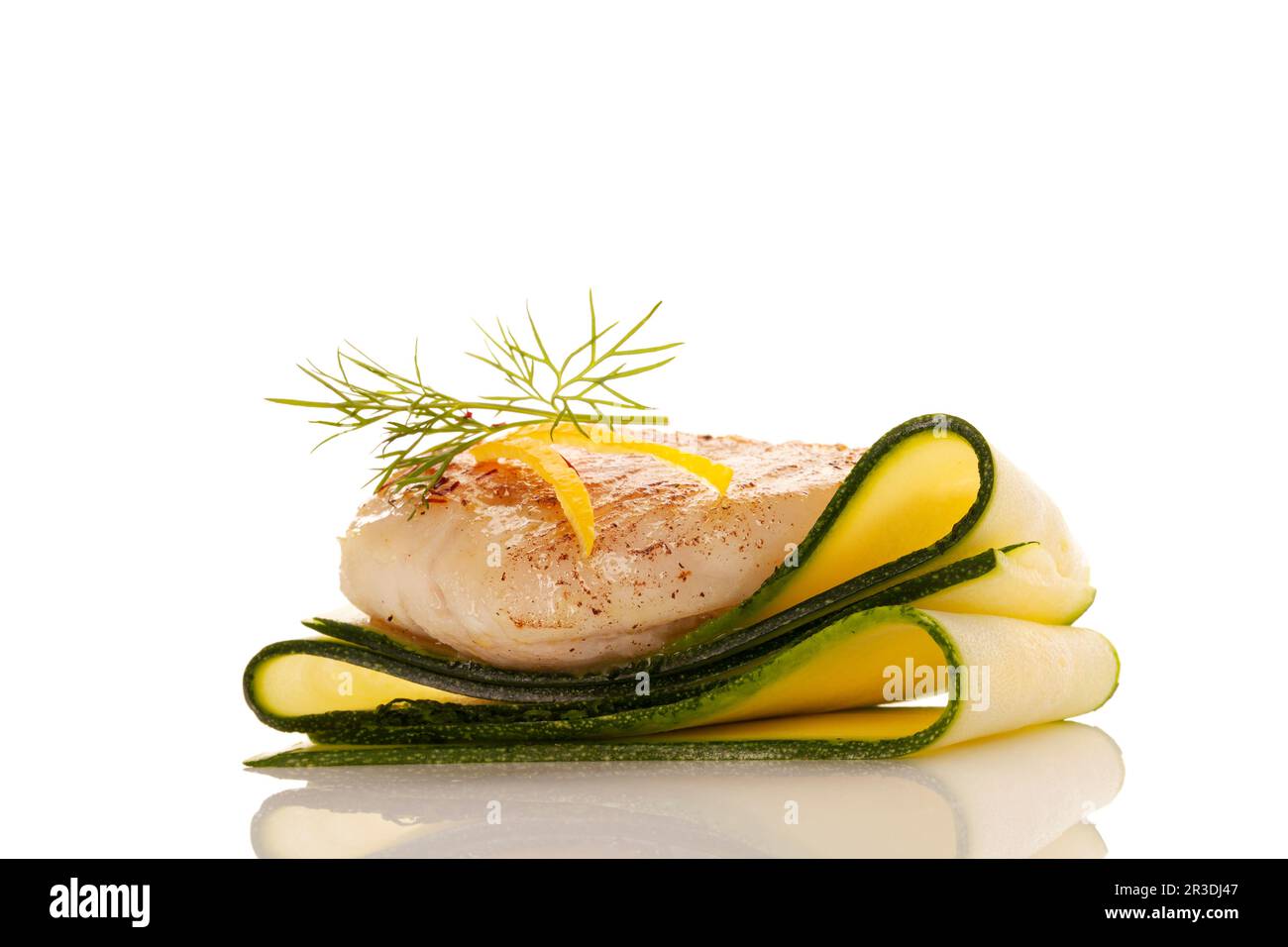 Luxurious seafood dinner. Perch fish fillet on zucchini slices Stock ...