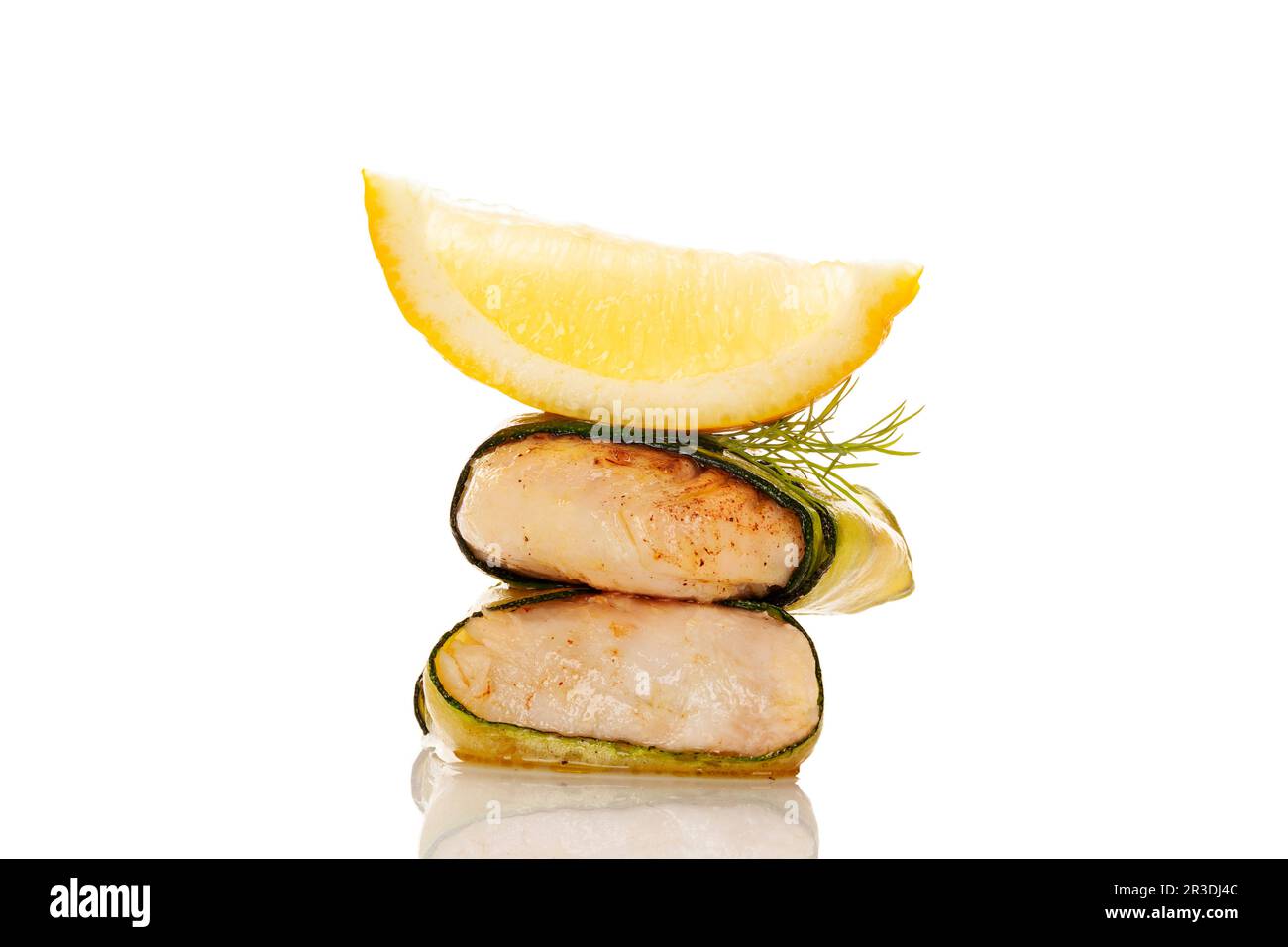 Luxurious seafood dinner. Perch fish fillet in zucchini slices Stock ...