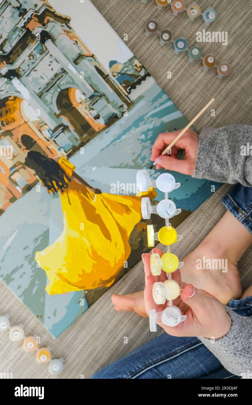 Female hands coloring canvas Picture by numbers girl Triumphal Arch ...