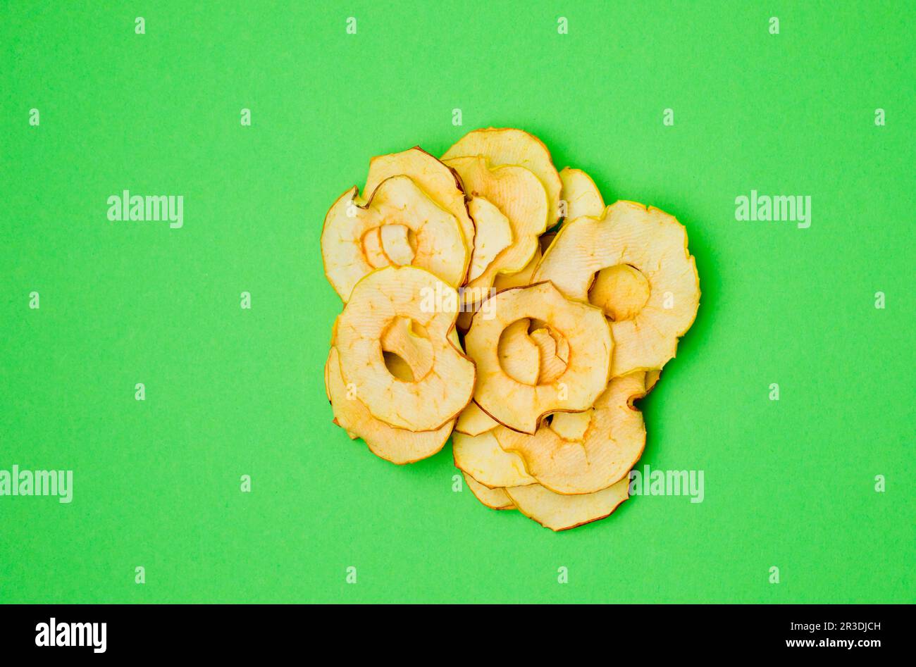 Top view the heap of round dried slices of apple Stock Photo - Alamy
