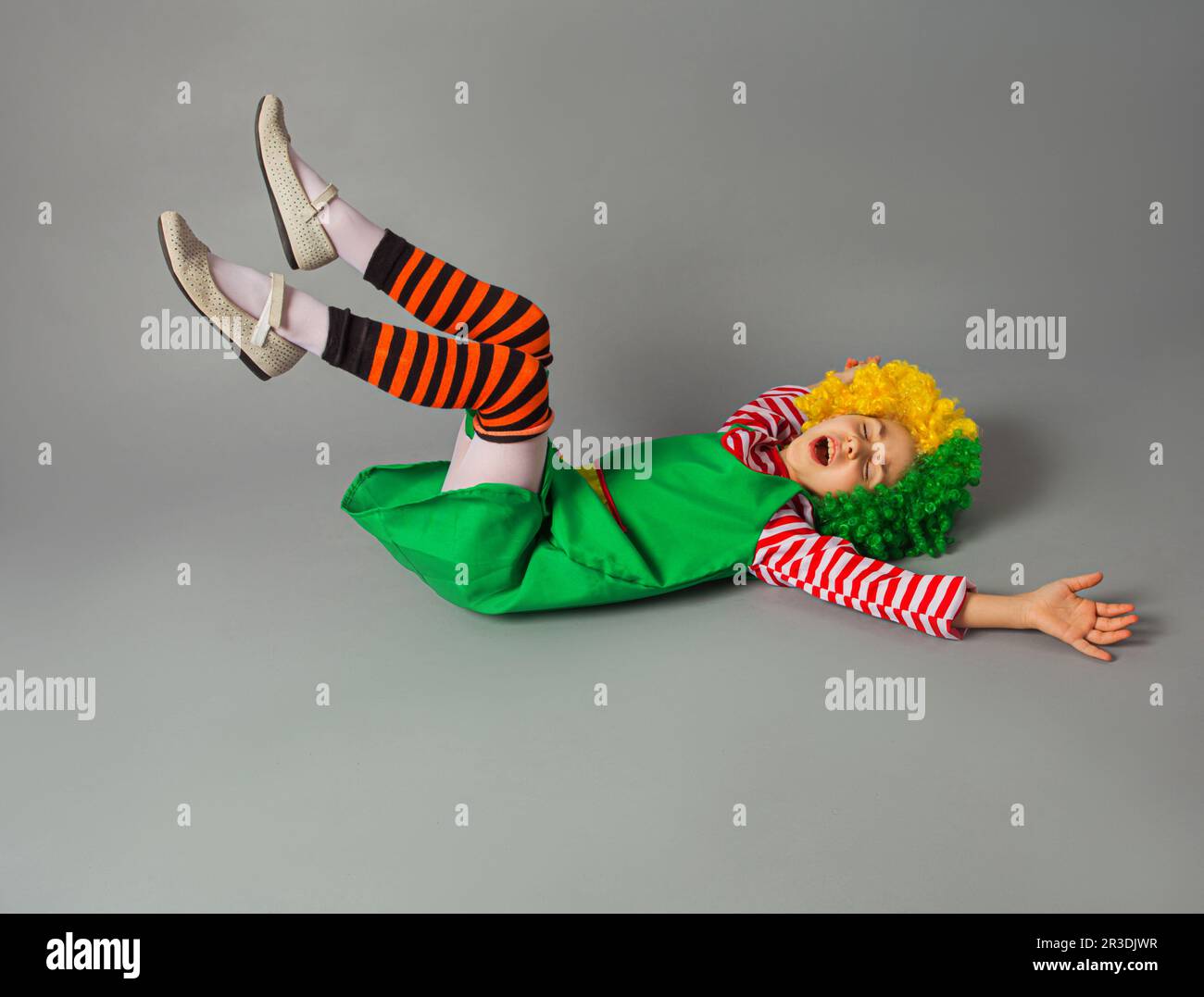 The little girl in a clown costume express emotions Stock Photo - Alamy