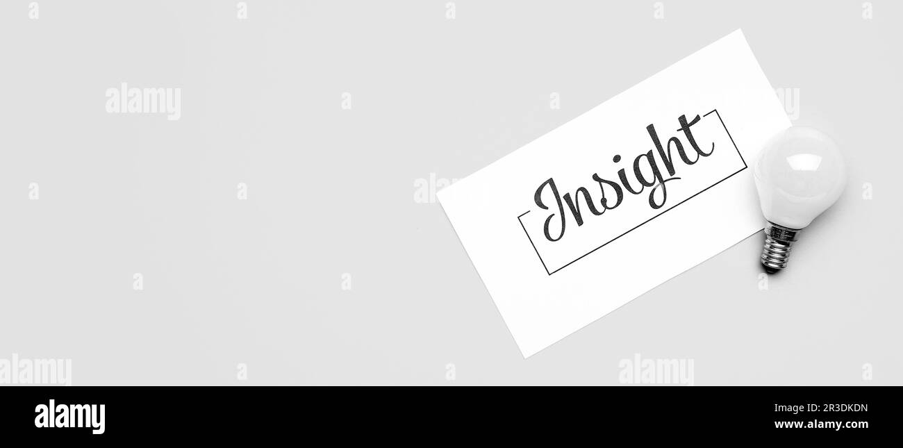 Paper with word INSIGHT and light bulb on light background with space ...