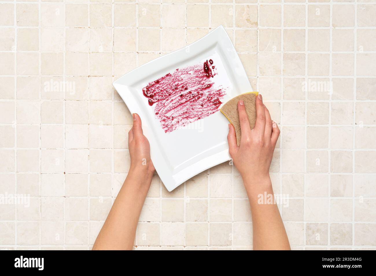 Woman washing dirty plate on tile background Stock Photo - Alamy