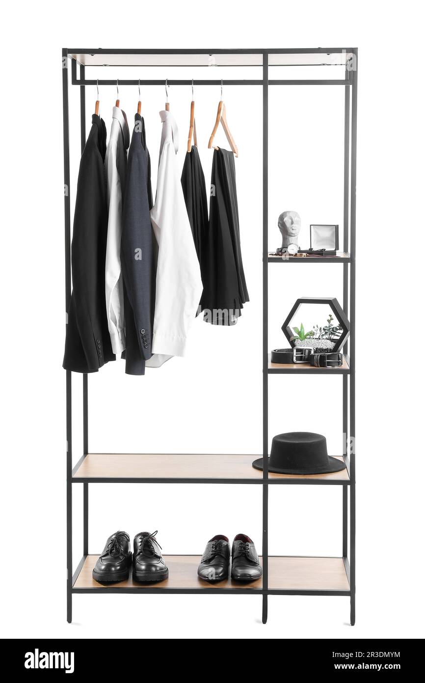 Shelving unit with clothes, shoes and accessories on white background ...
