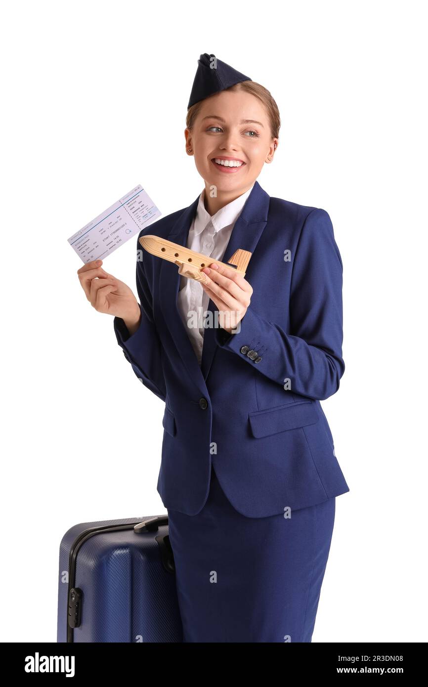 Beautiful stewardess with wooden airplane and ticket on white ...