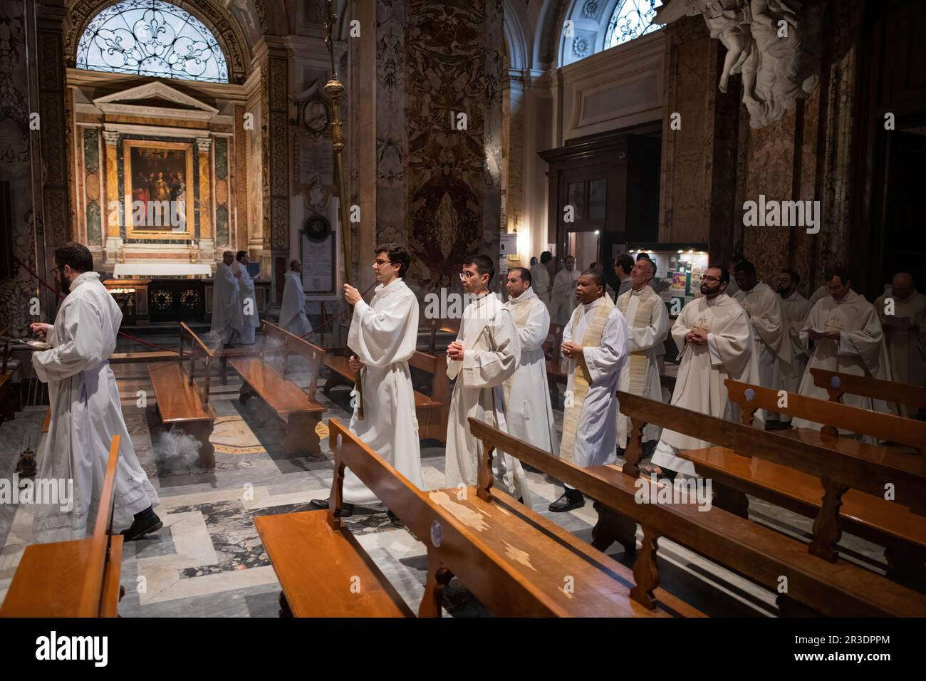 Priests in procession in the Church of San Luigi dei Francesi before ...