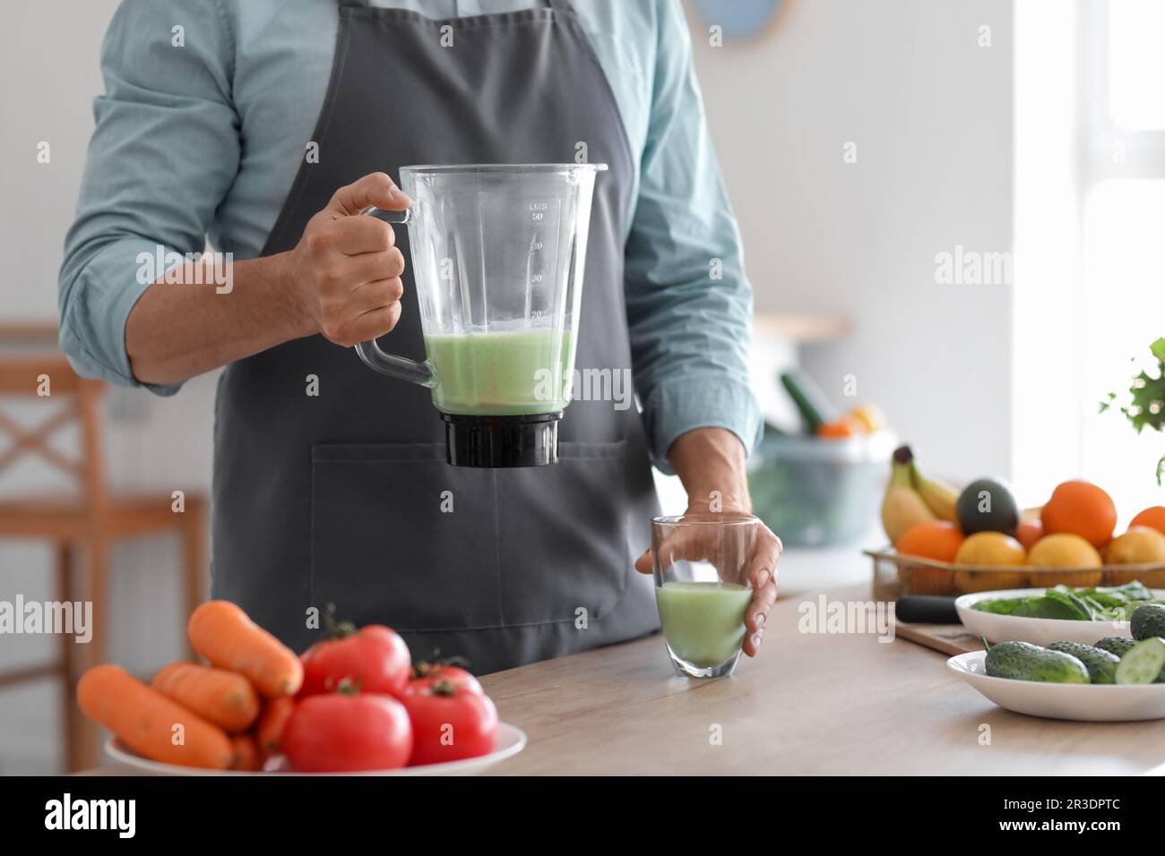 Man pouring healthy smoothie from hi-res stock photography and images ...