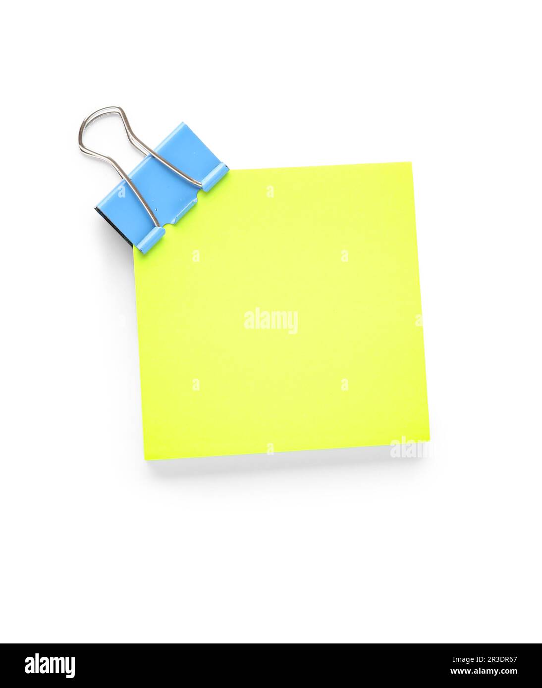 Yellow sticky note with paperclip on white background Stock Photo - Alamy