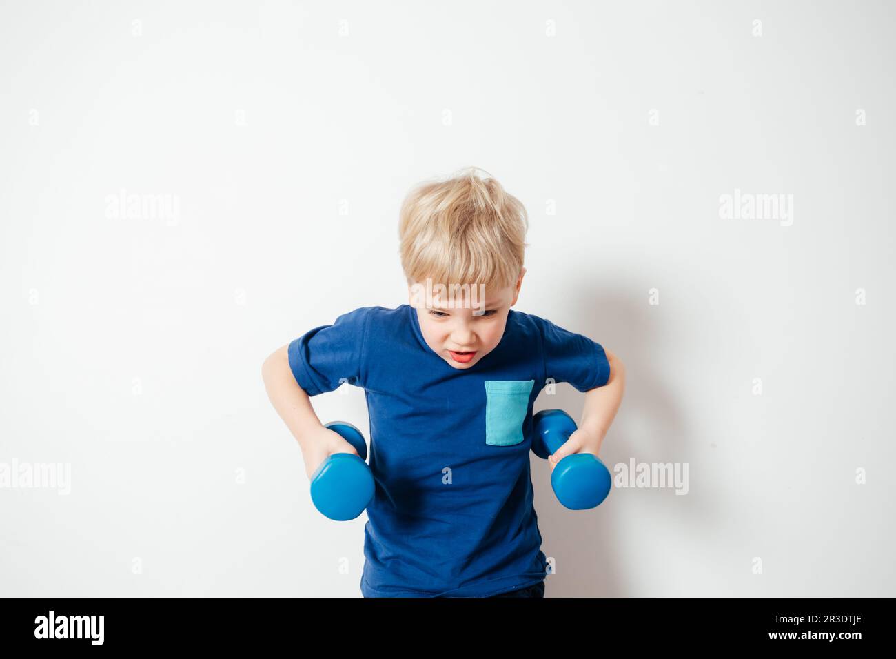 Active kids doing sport by following parents example Stock Photo - Alamy