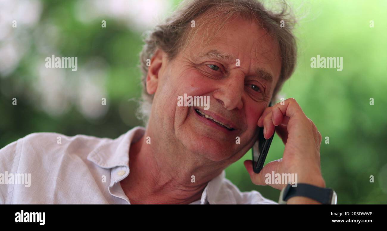 Happy smiling older man talking on phone. Candid senior person laughing ...