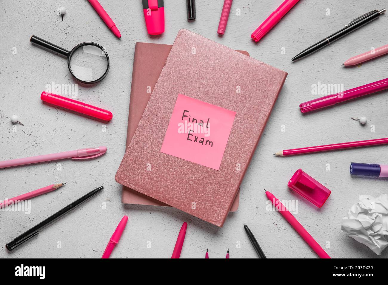 Frame made of different stationery and notebooks with text FINAL EXAM ...