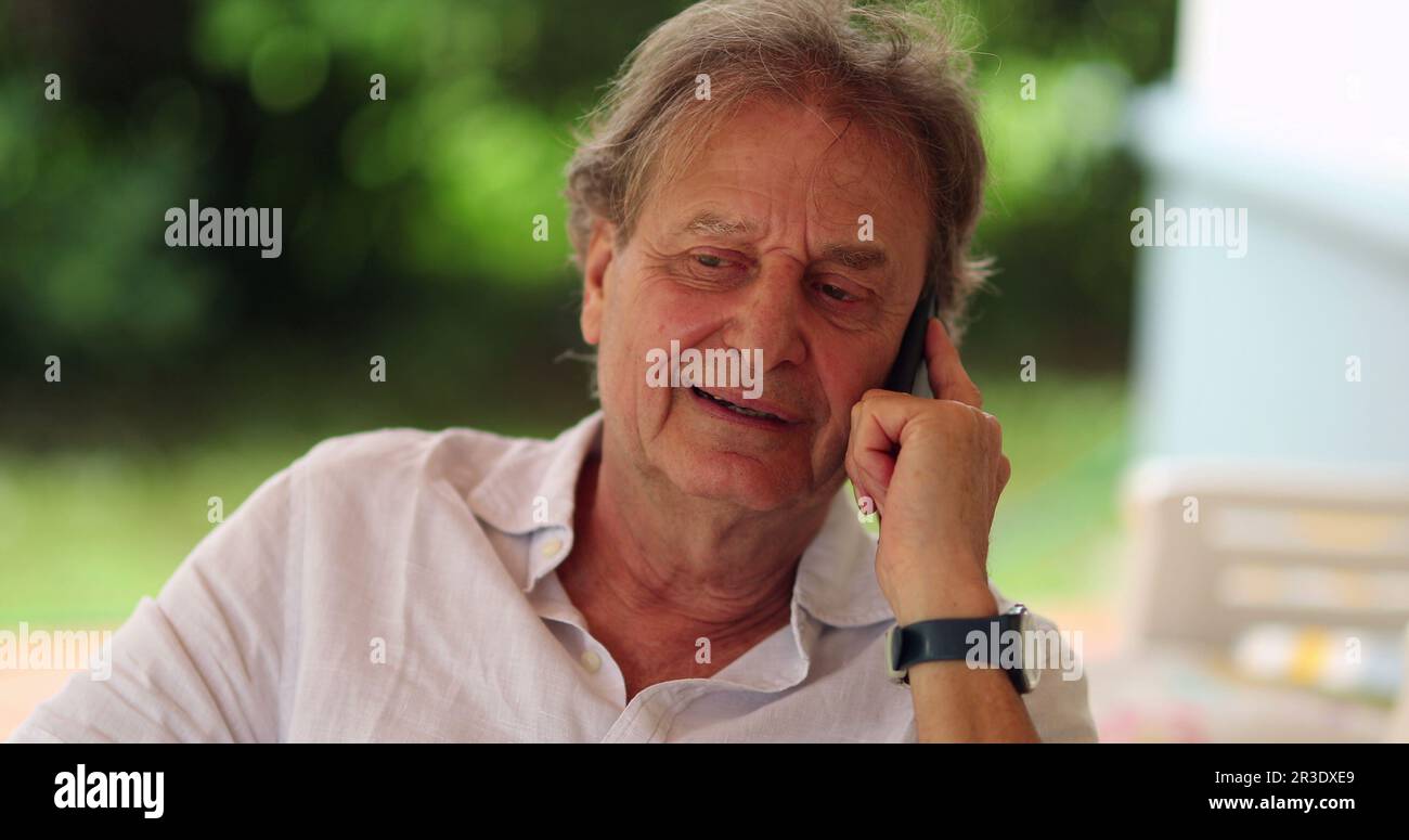 Older man talking on the phone. Candid authentic real life senior ...