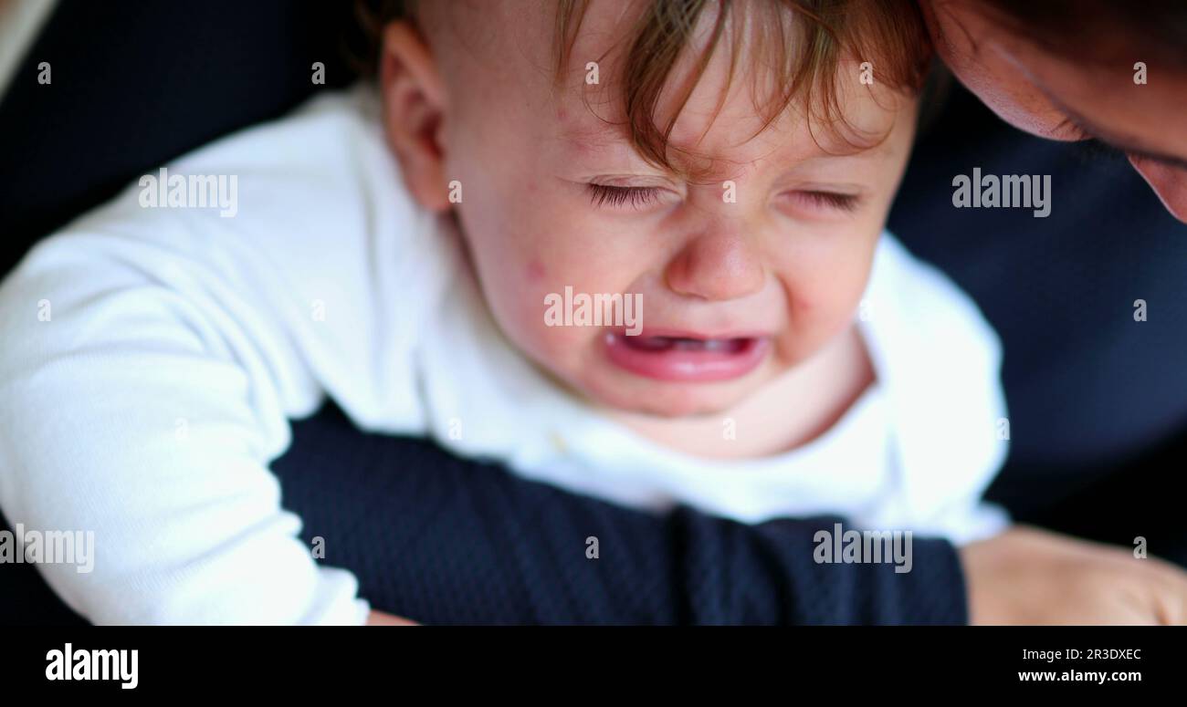 Mother clipping and trimming crying baby infant son Stock Photo - Alamy