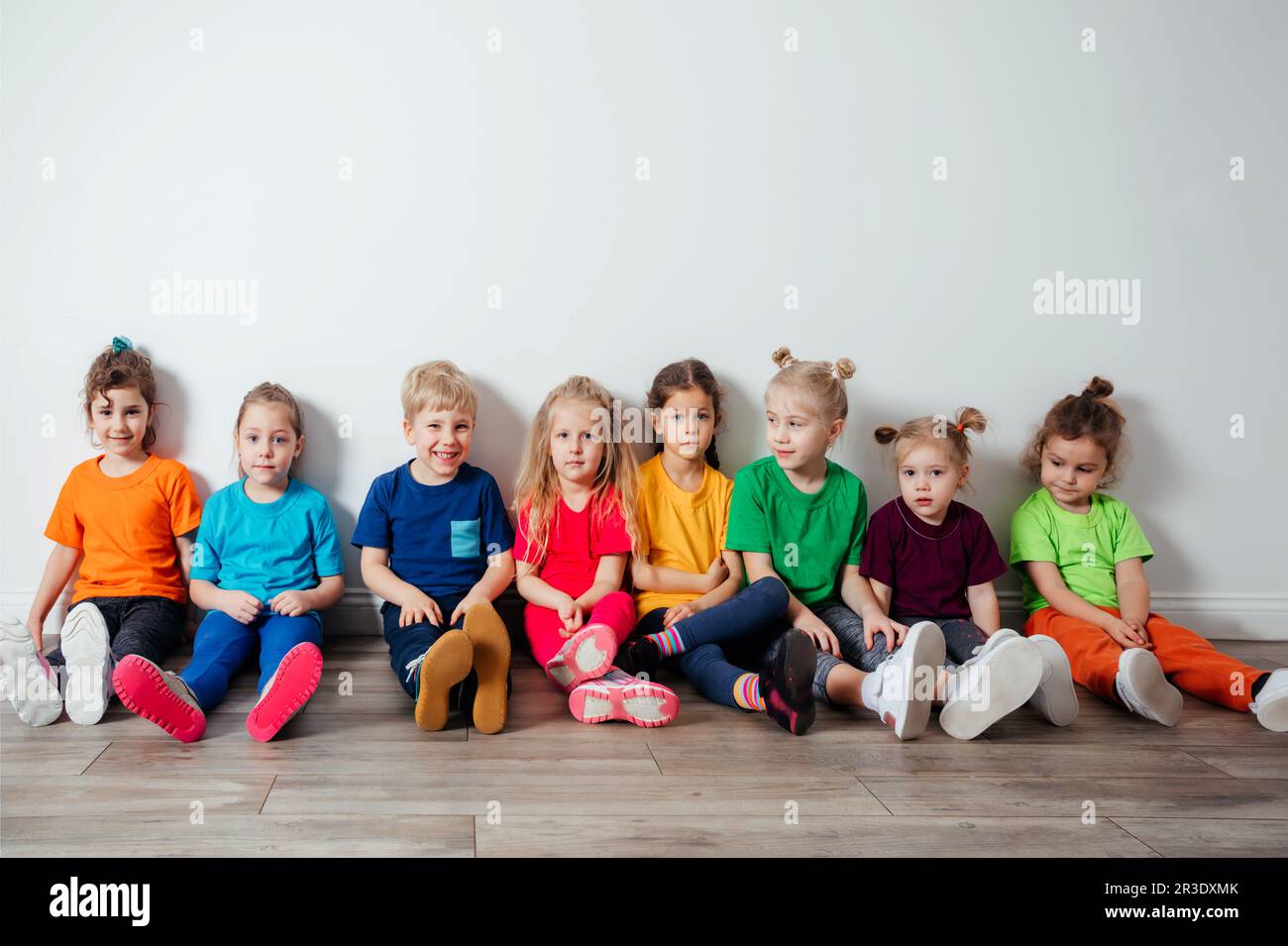 Children sitting on the floor hi-res stock photography and images - Alamy