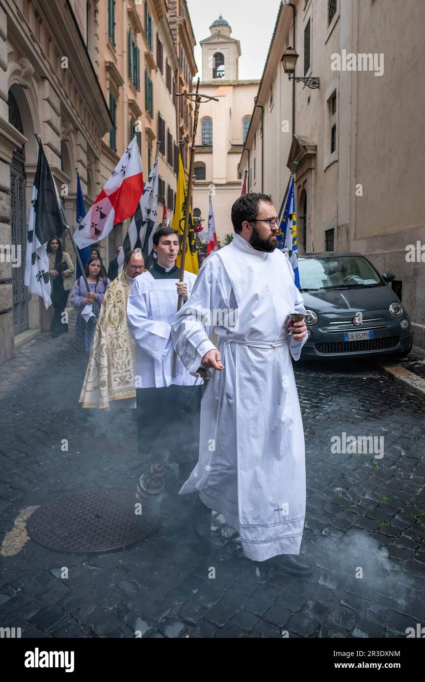 May 19, 2023, Rome, Italy: A priest incenses the procession route to ...