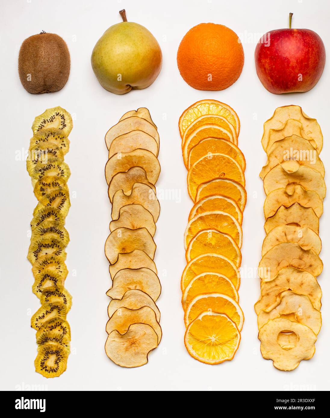 The dry pieces of different fruits elongated in a row to fresh fruits ...