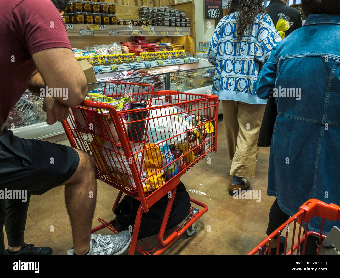 Shoppers on line at the Trader Joe’s check-out in New York on Friday ...