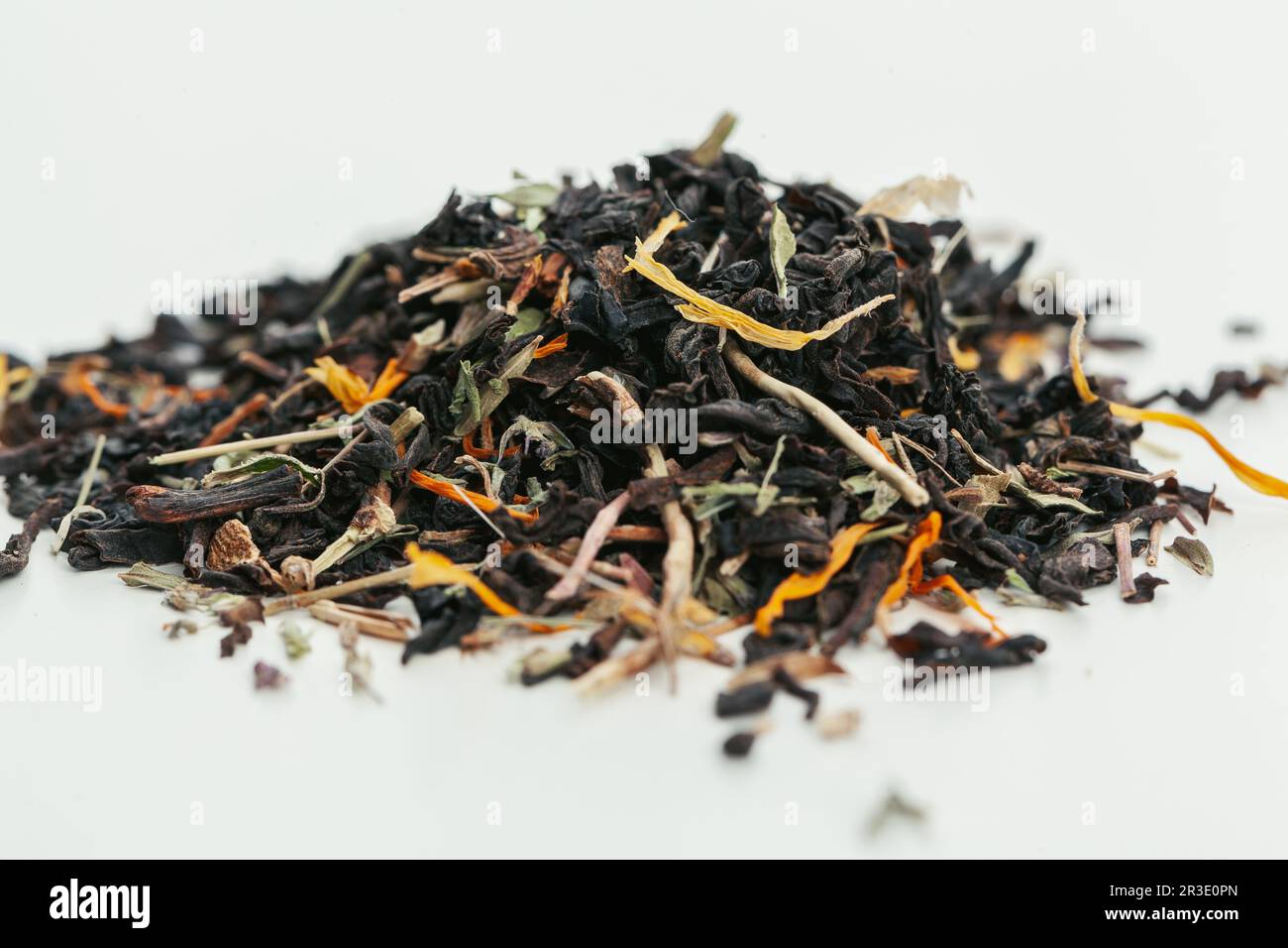 Dried tea leaves close up on white background Stock Photo - Alamy