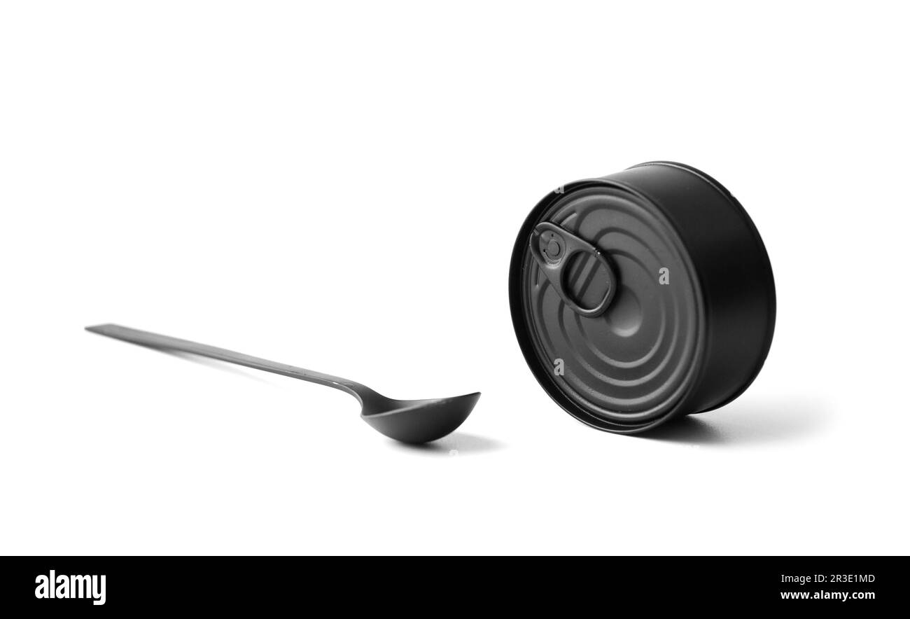 Black matte round closed tin can and black spoon on a white background ...