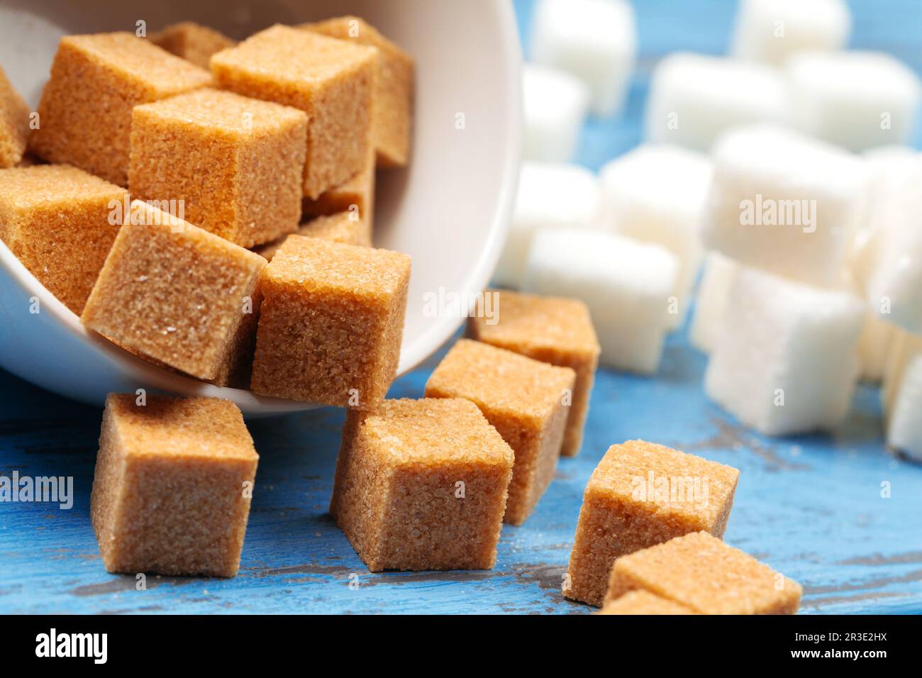 White refined sugar and brown unrefined sugar cubes Stock Photo - Alamy