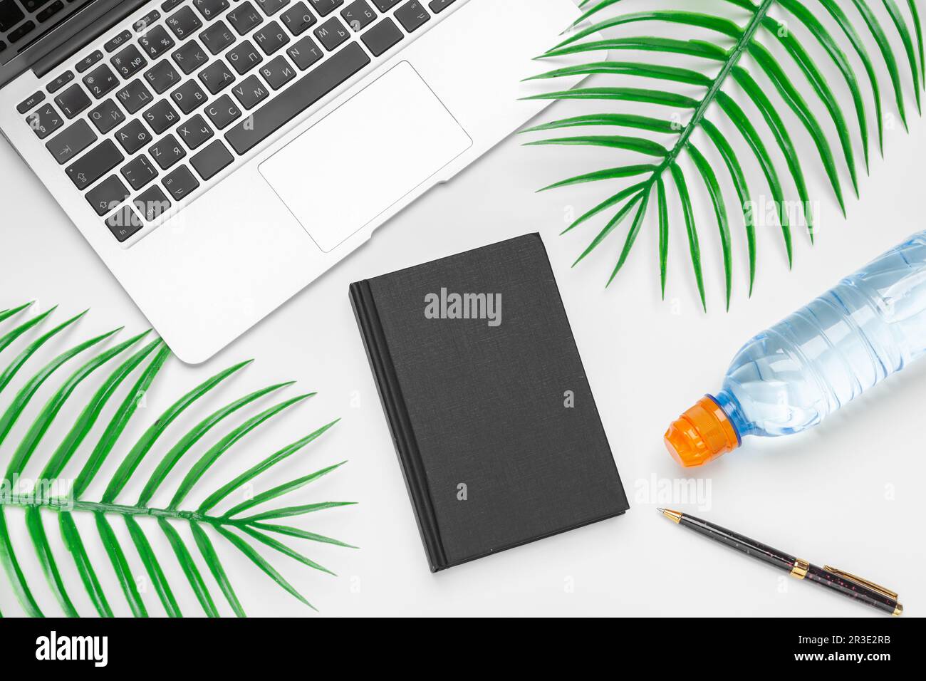 bottle of water on office table near laptop Stock Photo - Alamy