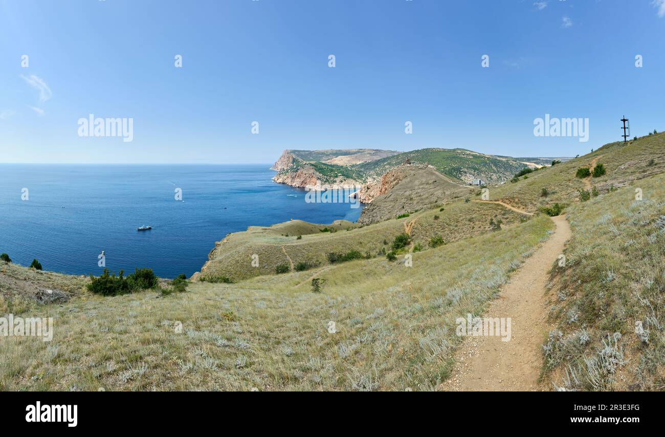 View along touristic trail towards Genoese fortress on cliffs edge west ...
