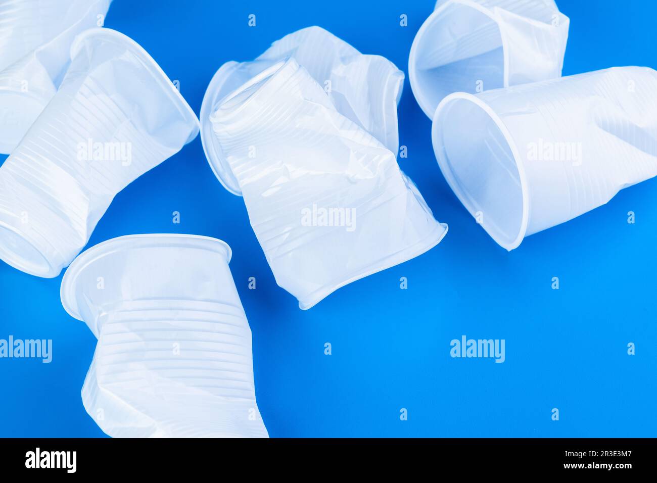 Disposable colored plastic cups garbage. Garbage and pollution concept ...