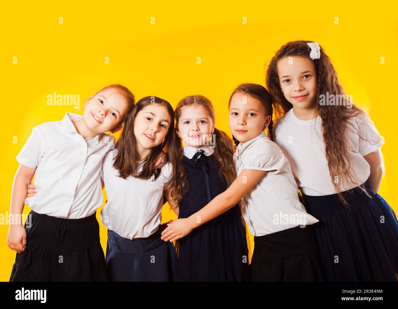 Happy kids, schoolgirls, glad to see each others Stock Photo - Alamy