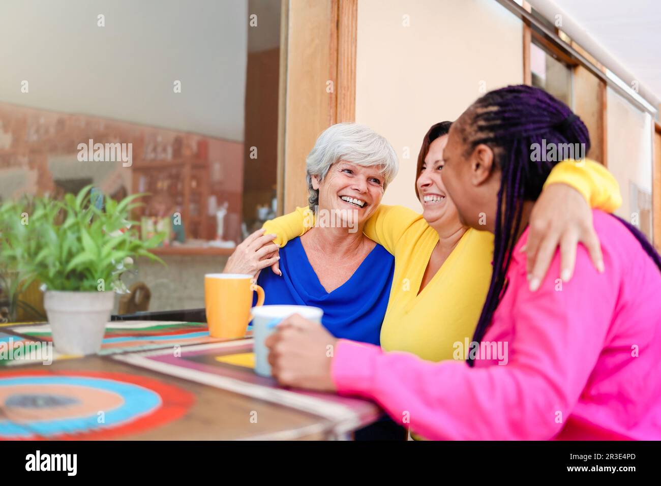 Happy senior friends having fun at restaurant bar outdoor - Multiracial ...